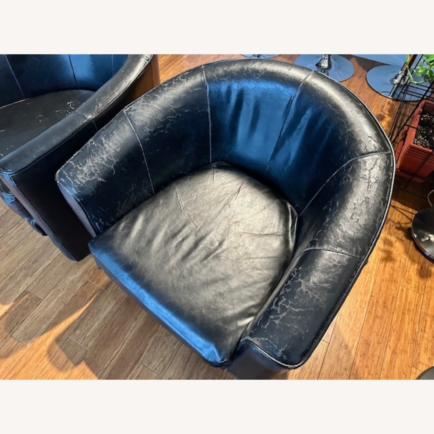 Raymour & Flanigan Fake Leather Rotating Living Arm Chairs - AptDeco