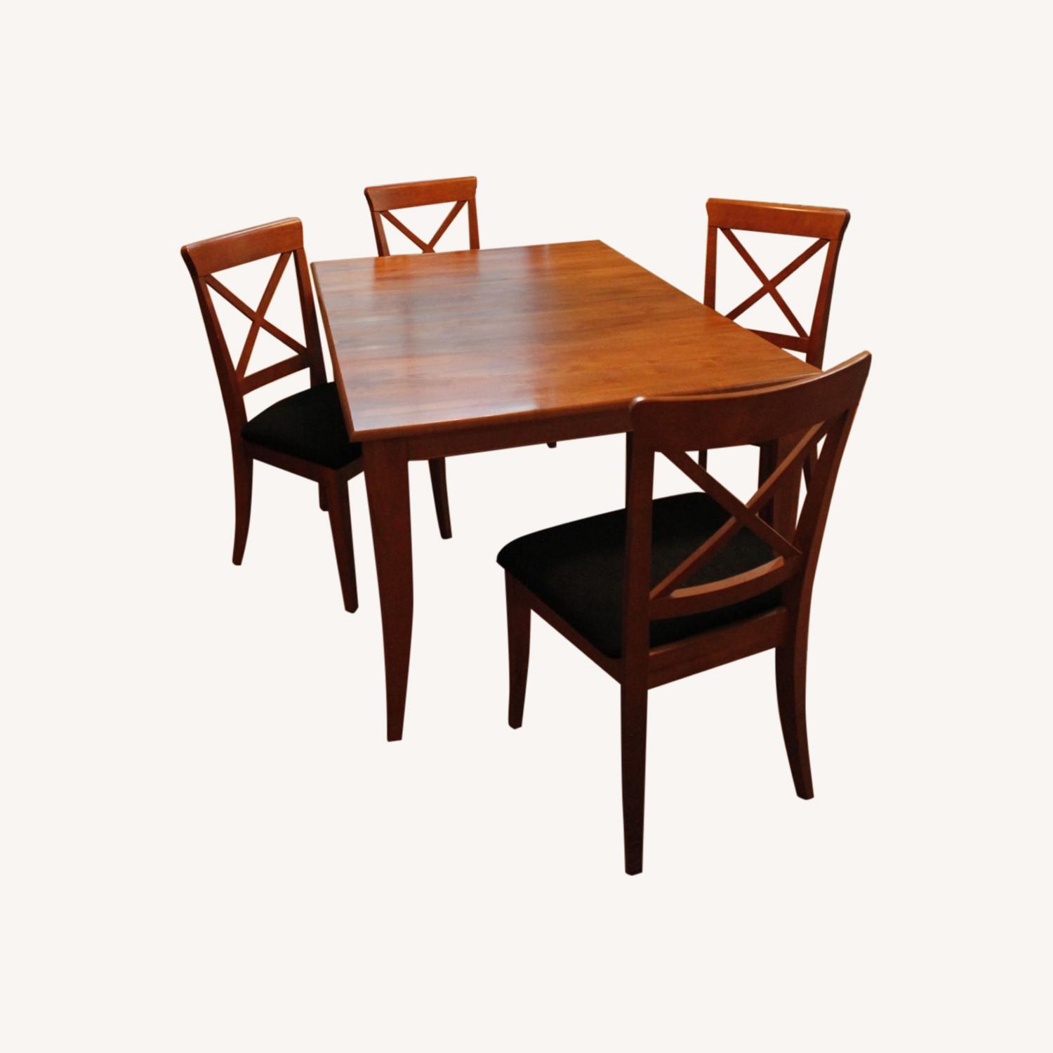 Extendable Wood Dining Table with 8 Chairs - AptDeco