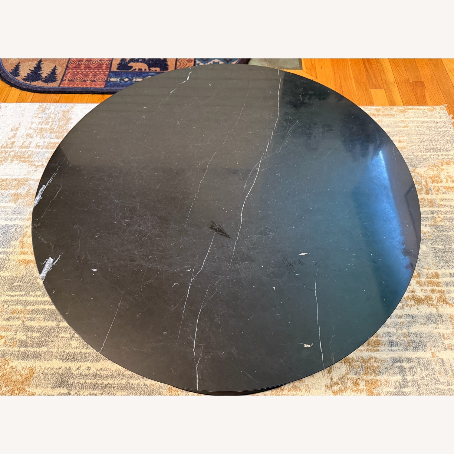 CB2 Black Round Marble Coffee Table - AptDeco