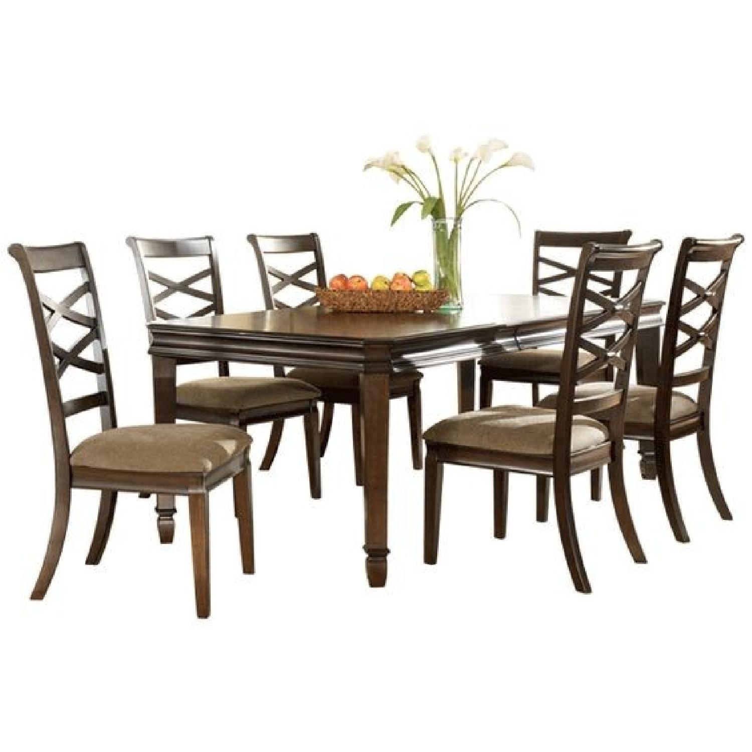Ashley Furniture Solid Wood Extendable Dining Table - AptDeco