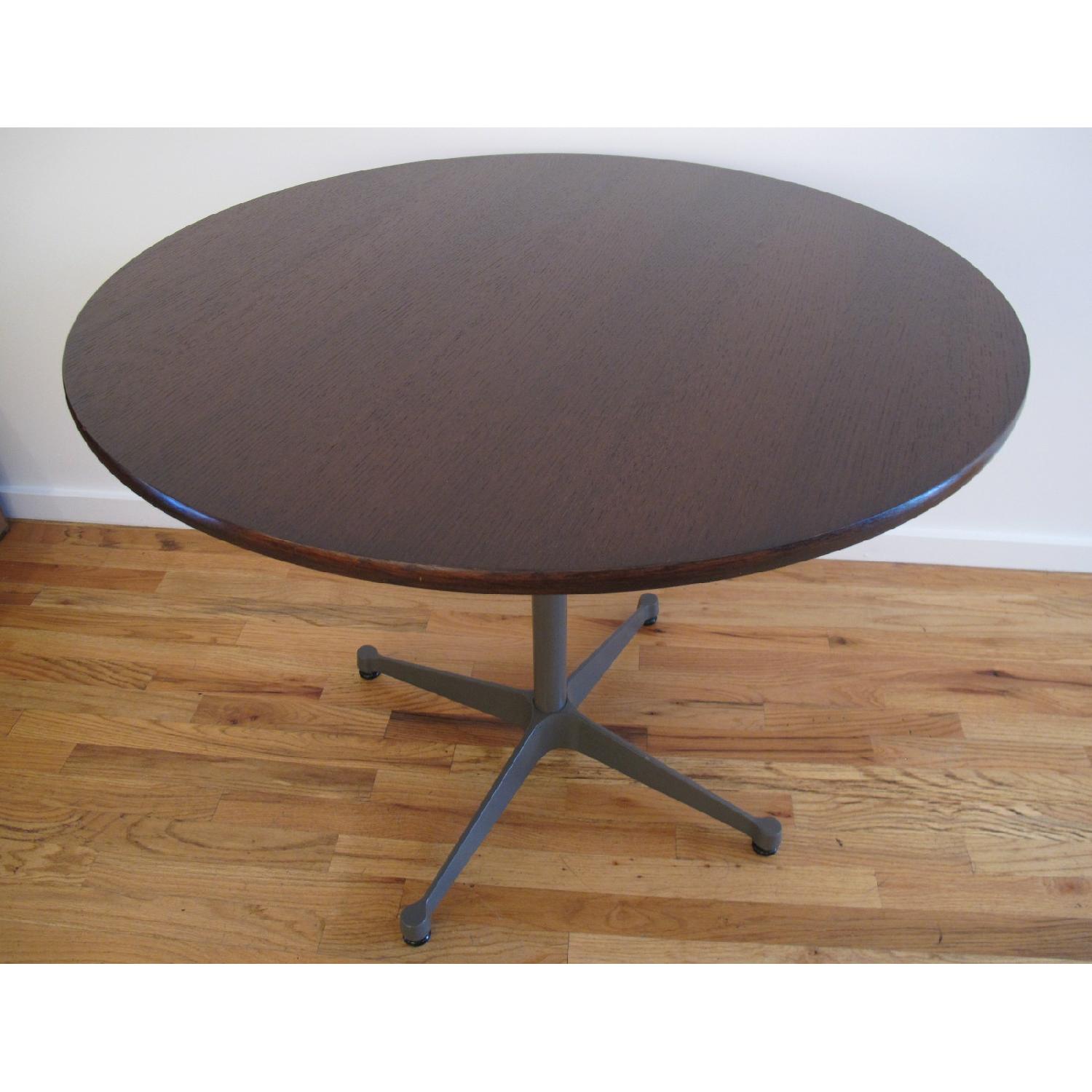 Herman Miller Round Dark Wood Dining Table - AptDeco