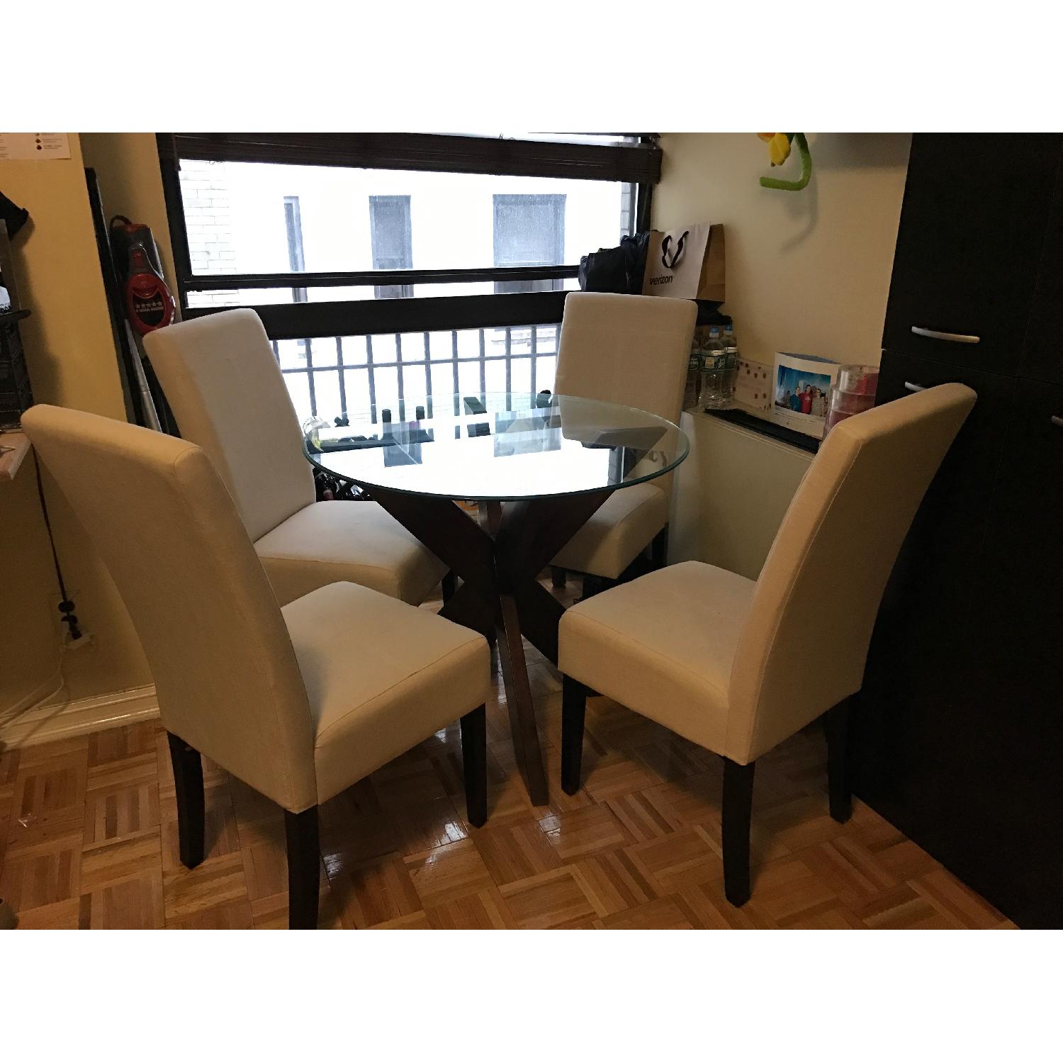 Pier 1 Simon Round Glass Top/X Base Dining Table w/ 4 Chairs - AptDeco