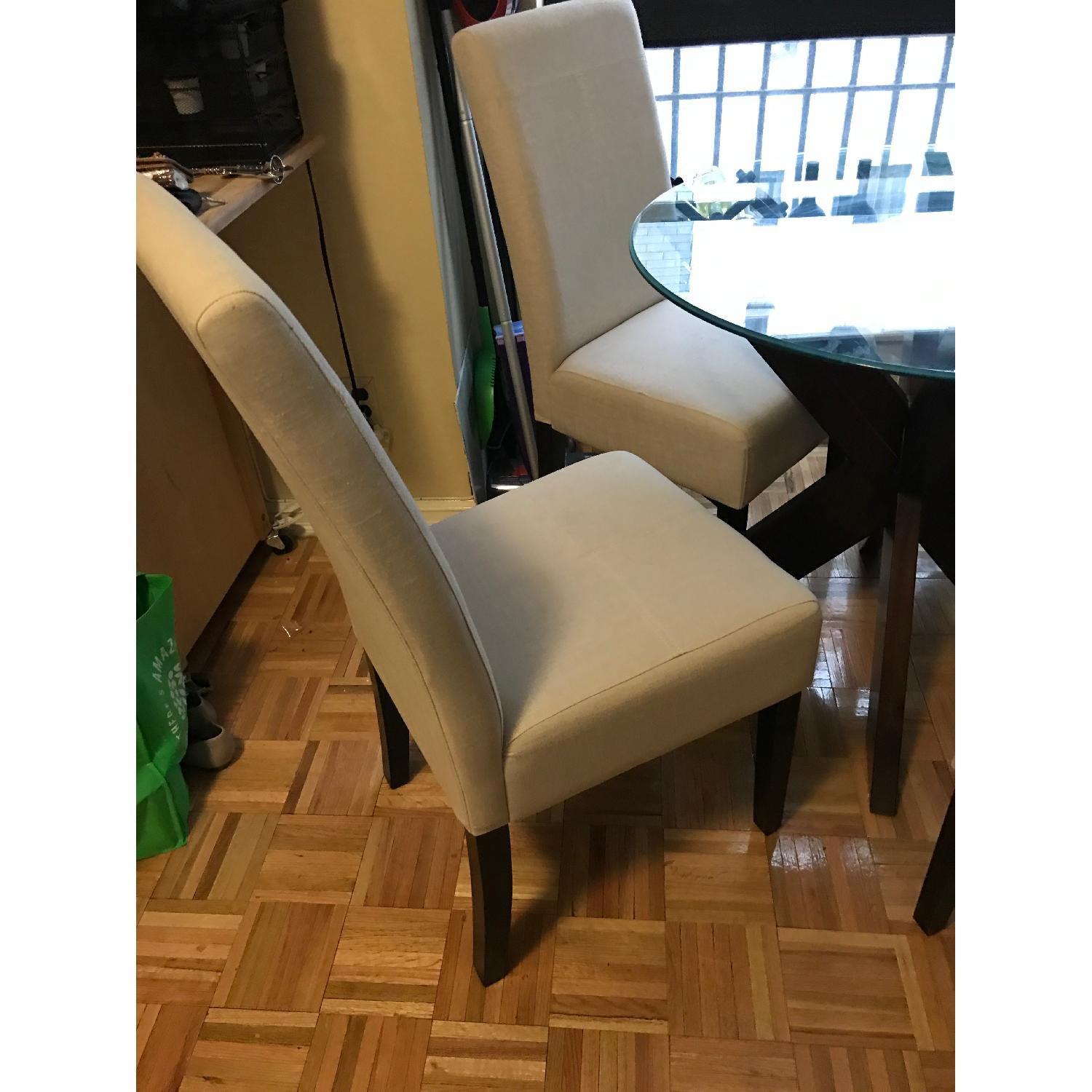 Pier 1 Simon Round Glass Top/X Base Dining Table w/ 4 Chairs - AptDeco