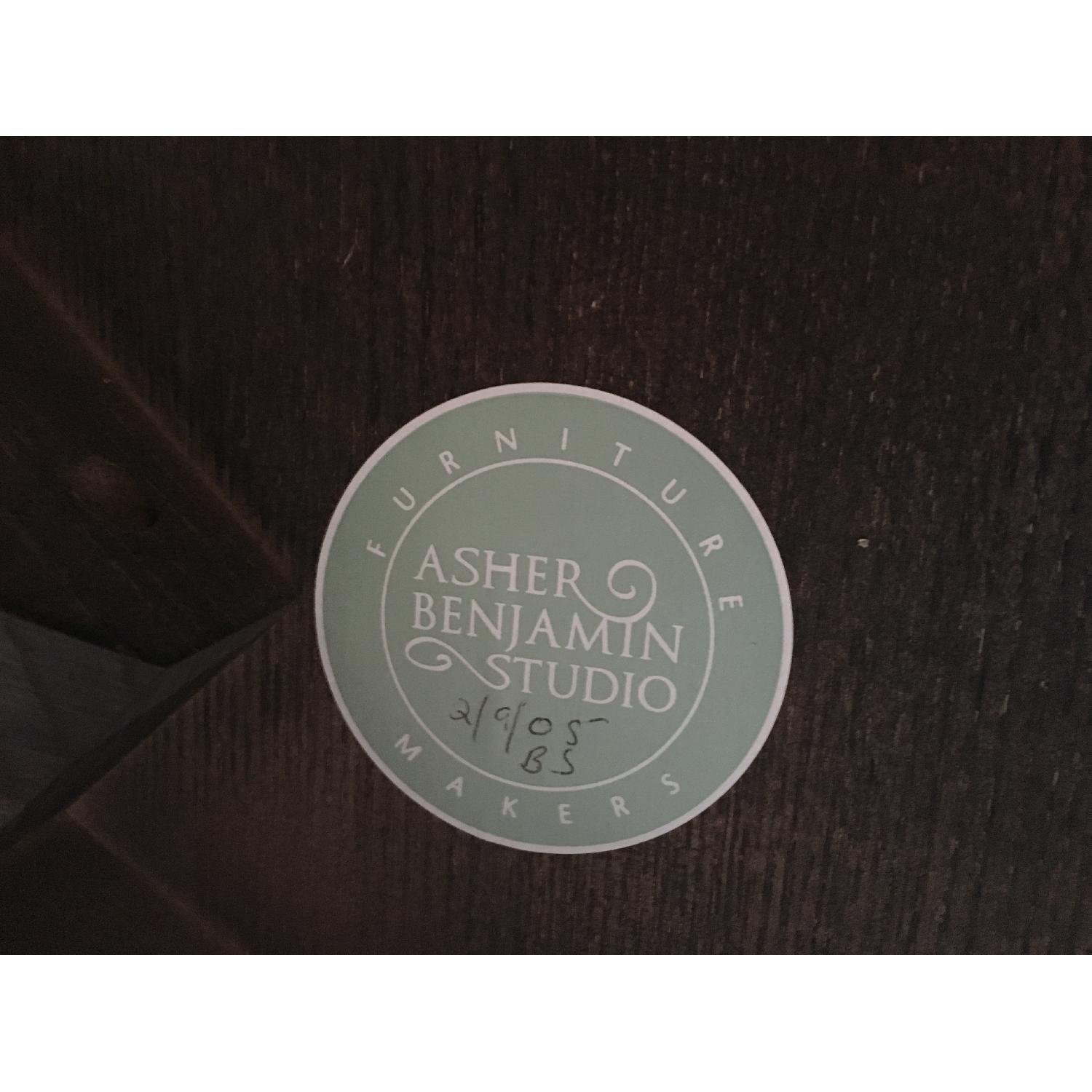 Crate & Barrel Asher Benjamin Solid Oak Round Dining Table - AptDeco