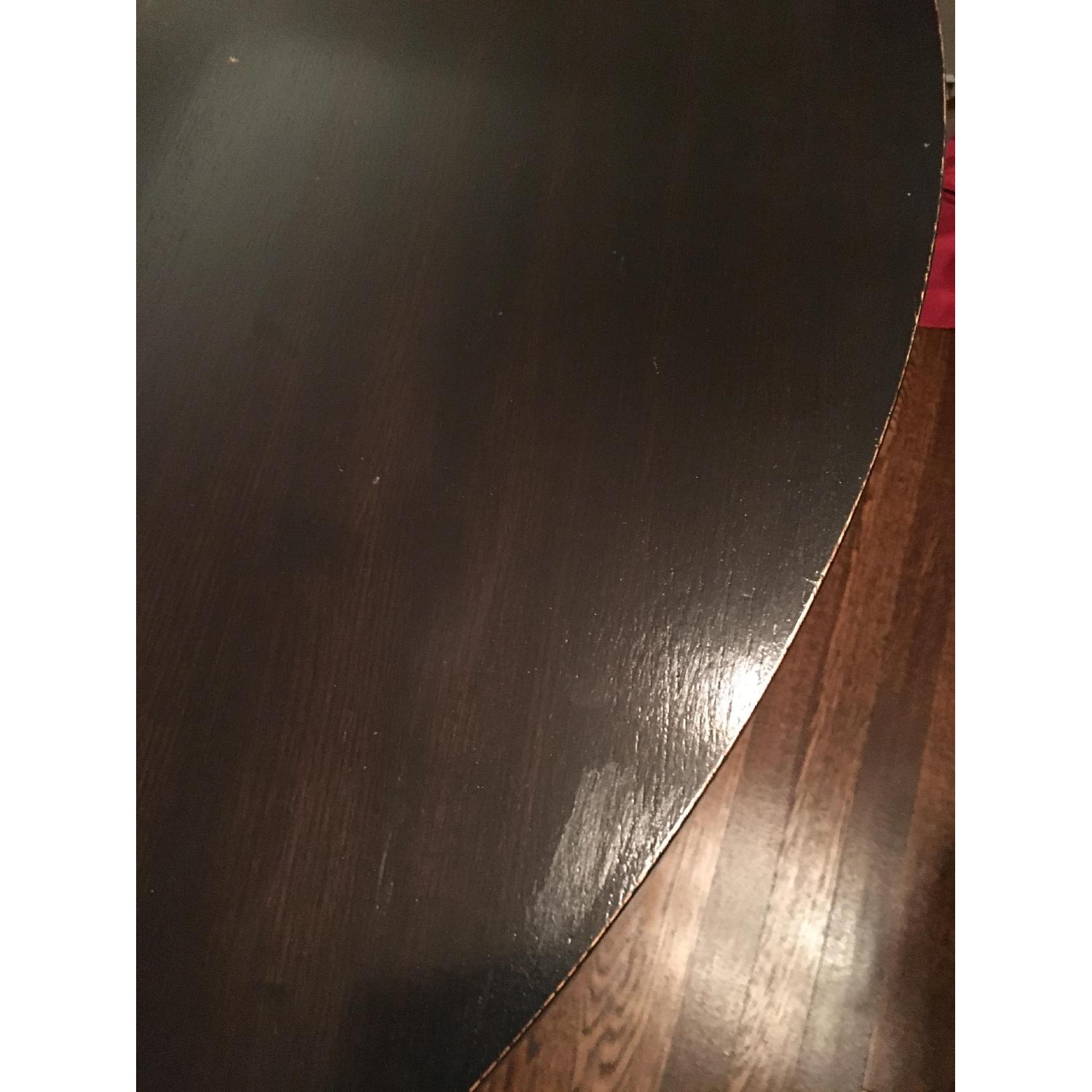 Crate & Barrel Asher Benjamin Solid Oak Round Dining Table - AptDeco