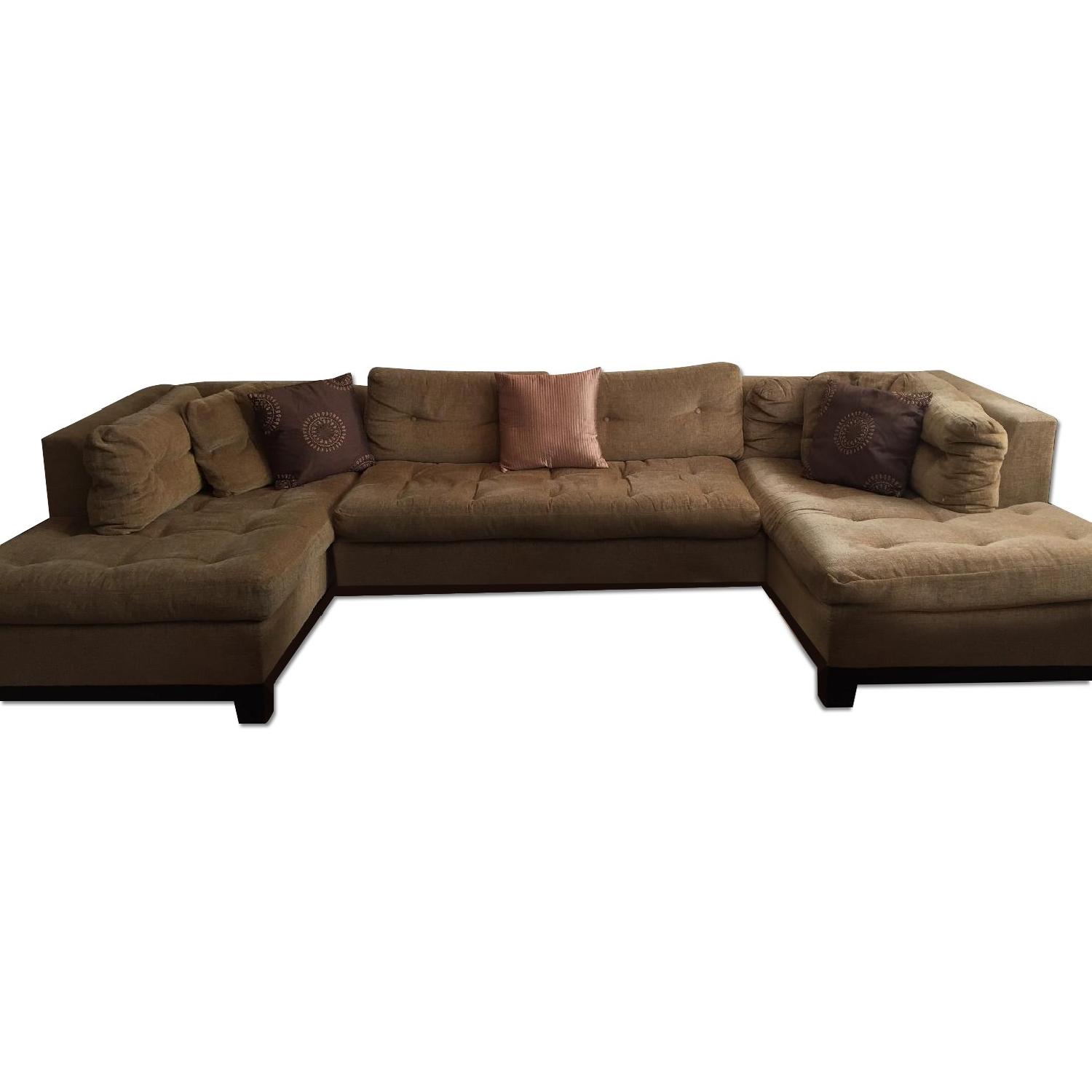 ABC Carpet and Home Beige U Shaped Couch w/ Dark Wood Base - AptDeco