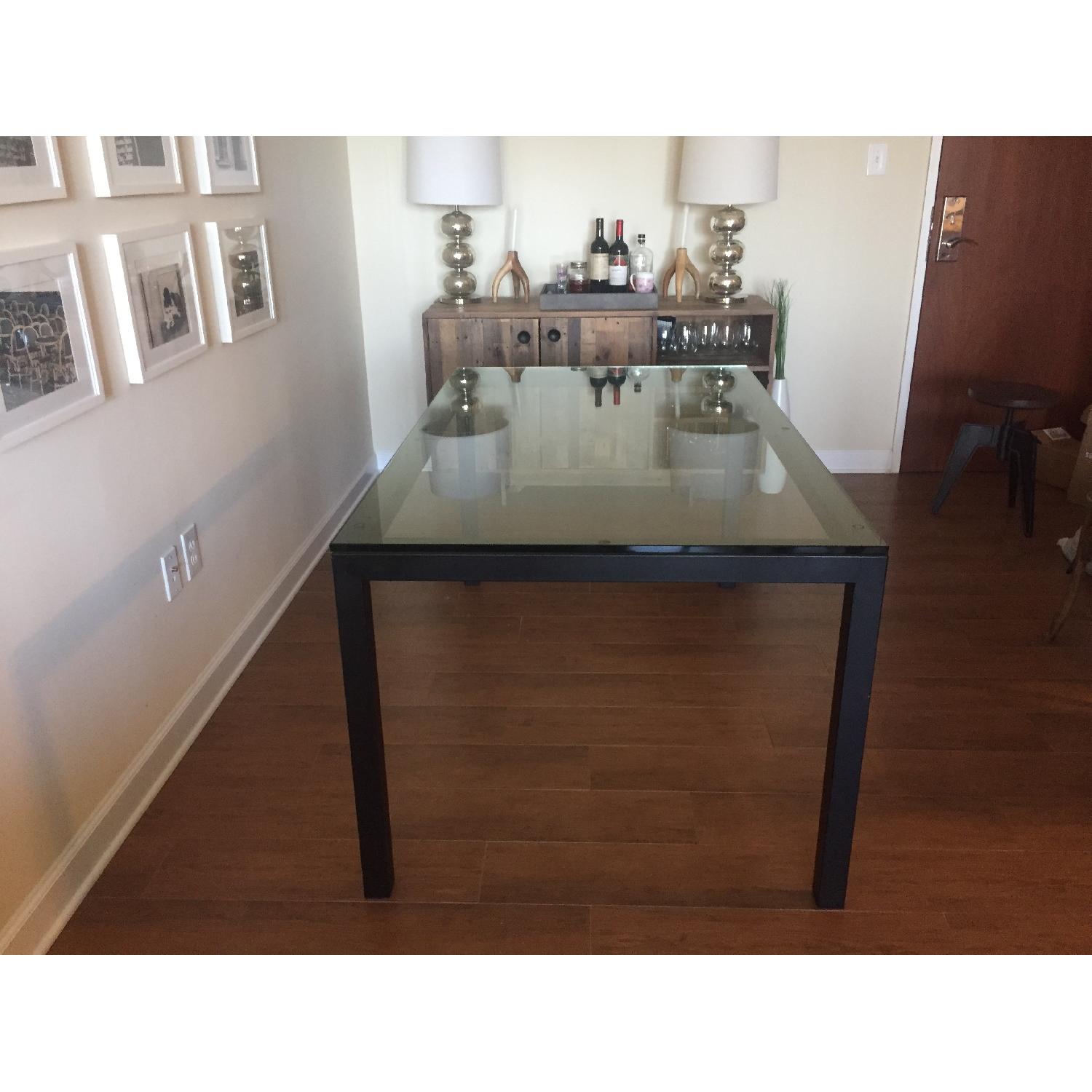 Crate & Barrel Parsons Glass Top/Dark Steel Base Table - AptDeco