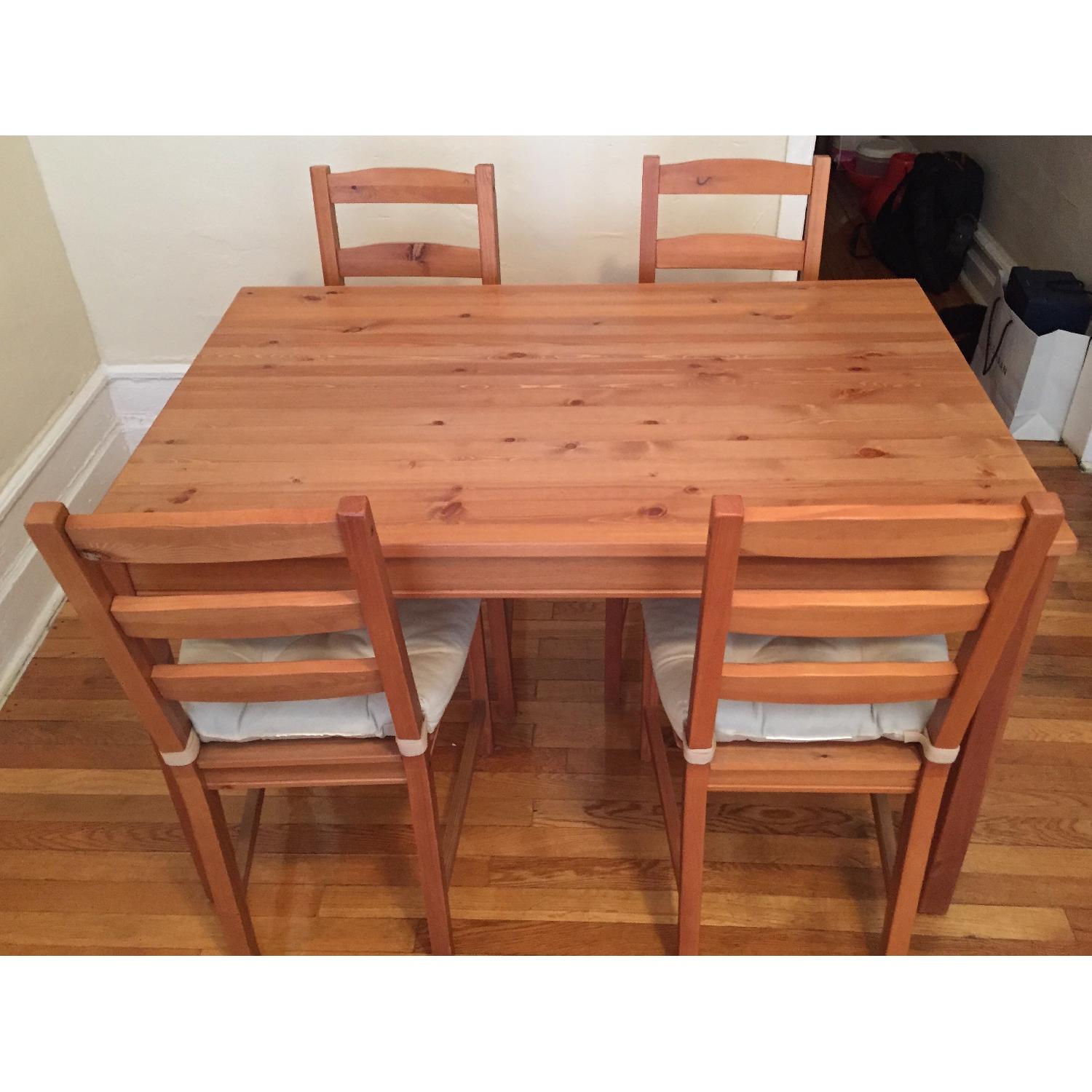 Ikea Solid Pine Wood Table w/ 4 Chairs - AptDeco
