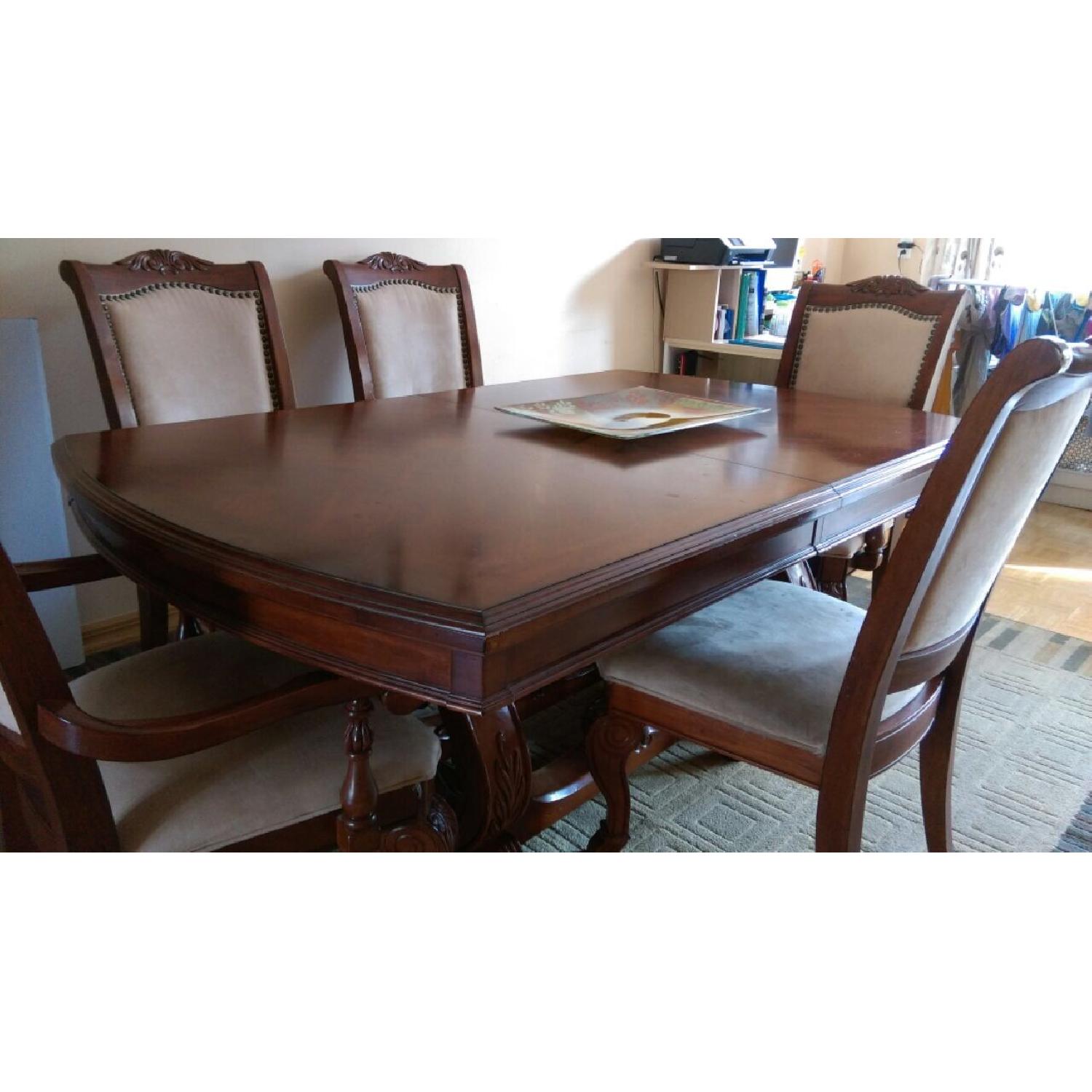 Levitz Furniture Oak Wood Dining Table w/ 6 Chairs - AptDeco