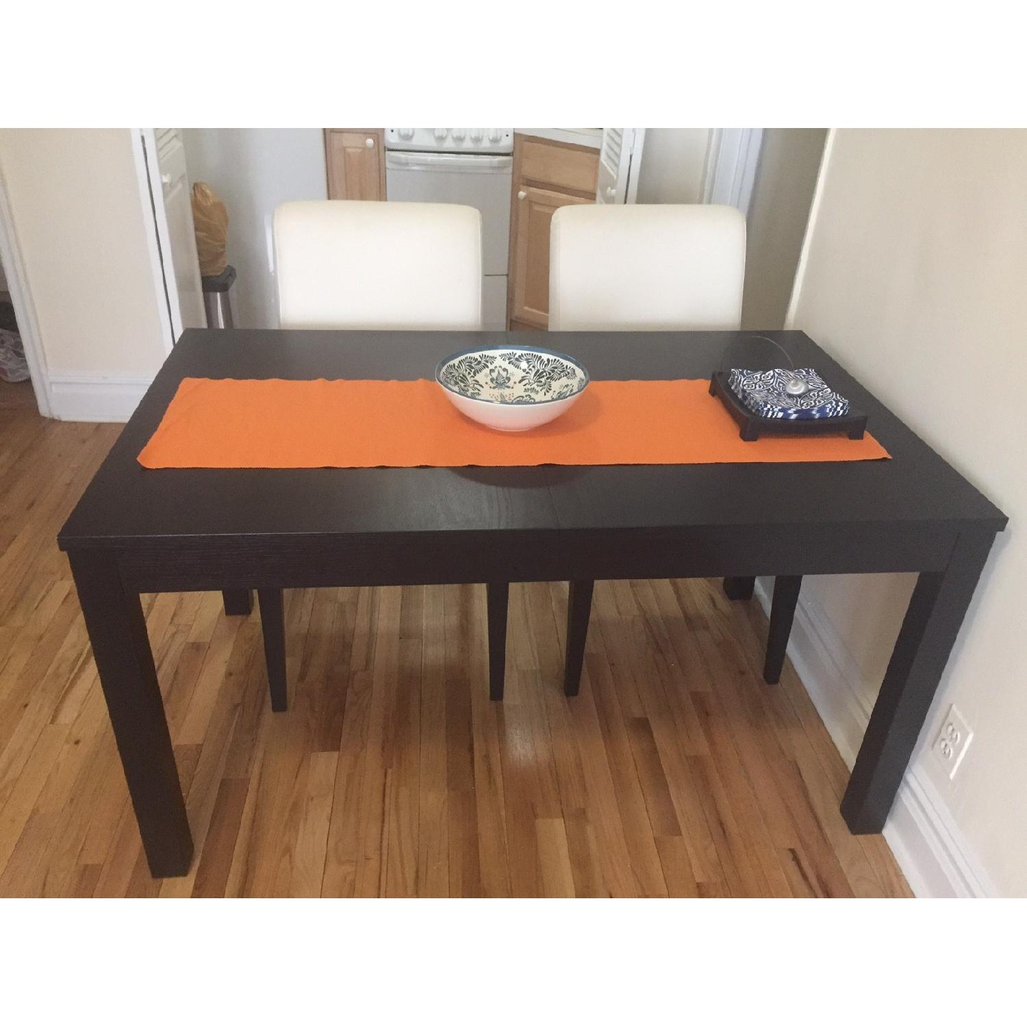 Ikea Bjursta Extendable Dining Table in Black - AptDeco